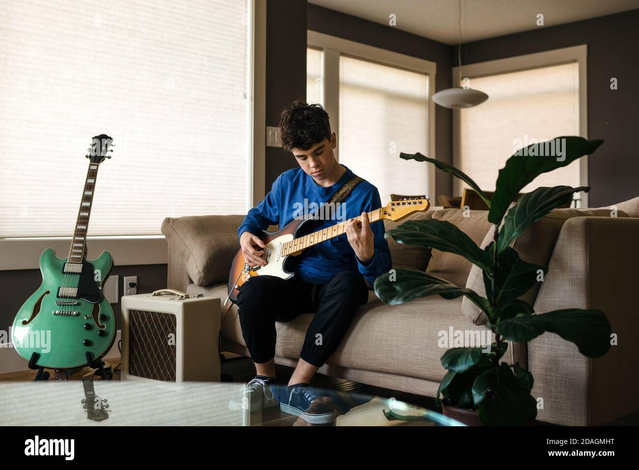 Teens playing instruments hi-res stock photography and images - Alamy