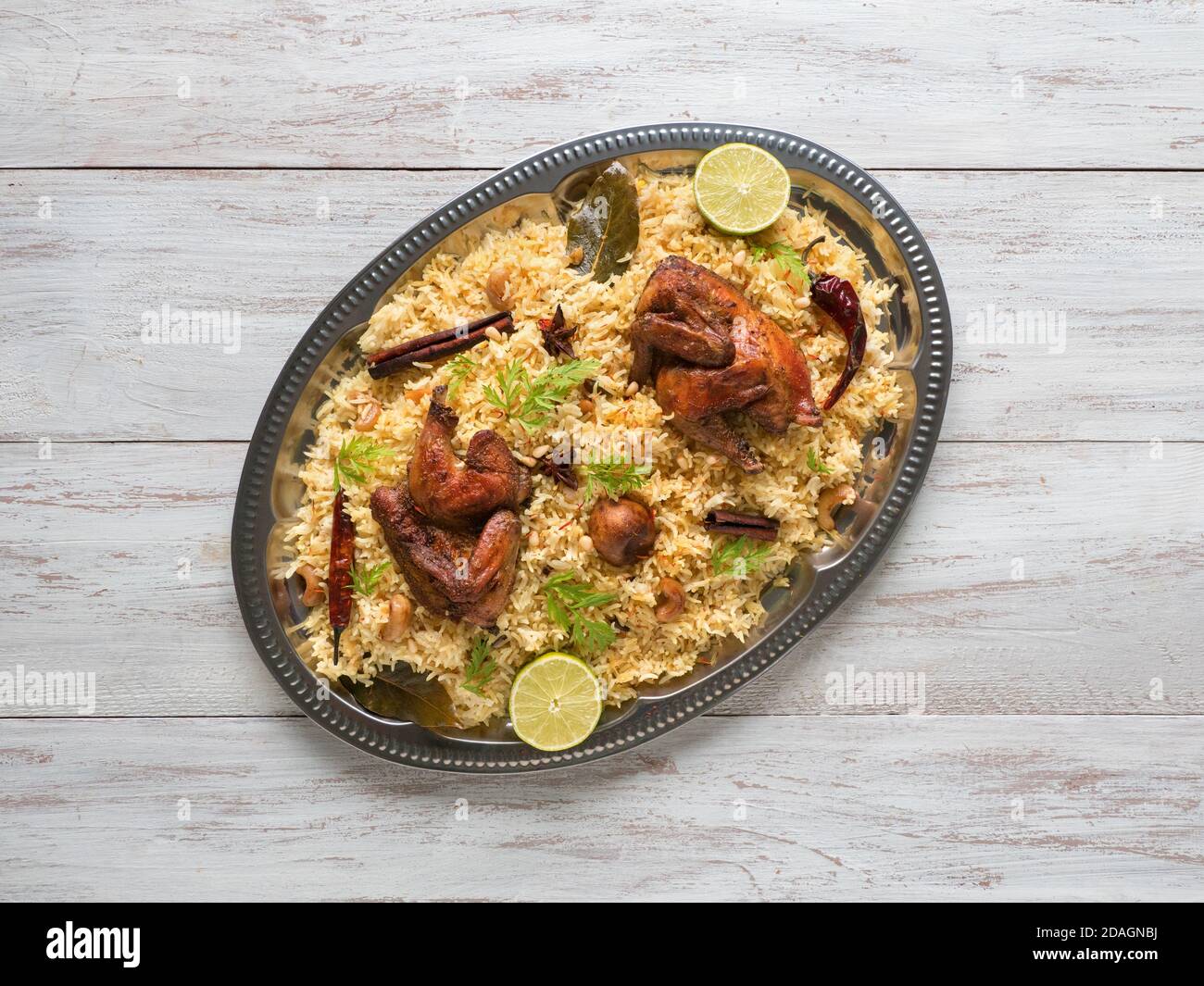 Homemade chicken Biryani. Arabic traditional food bowls Kabsa with meat ...