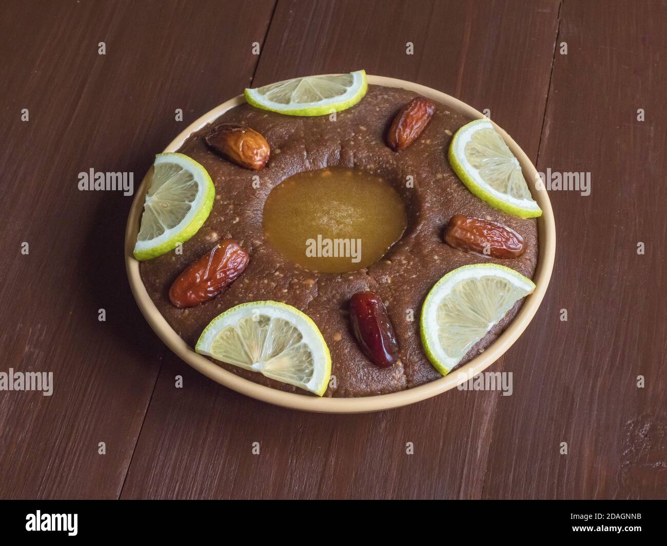 Saudi Arabia traditional dish Hineni, it is a mixed of dates and whole wheat. Ramadan food Stock ...
