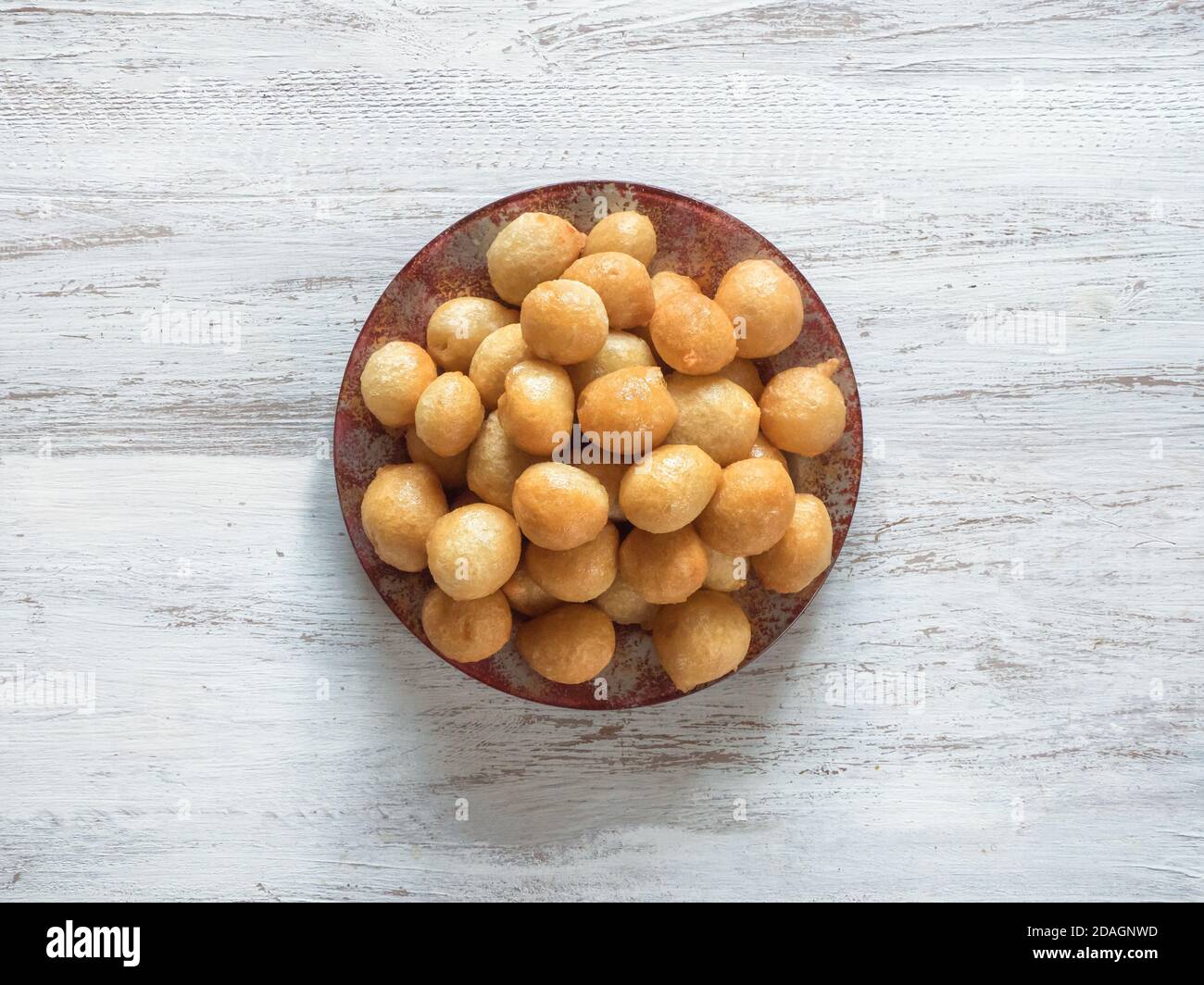 Traditional Greek sweets Loukoumades from dough with honey syrup Stock ...