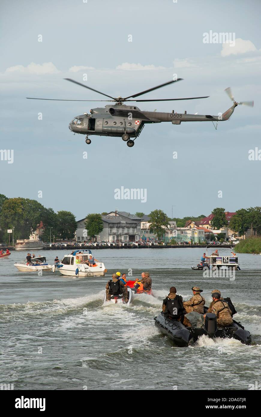 Commandos on boats under the Mi-8 helicopter. Photo taken after the ...