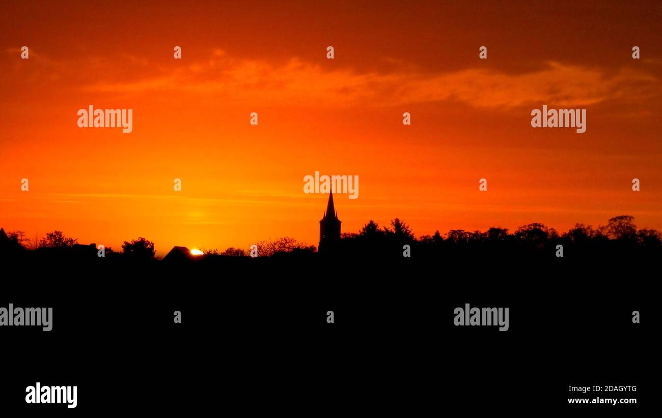 Church steeple and tree silhouette at sunset Stock Photo - Alamy