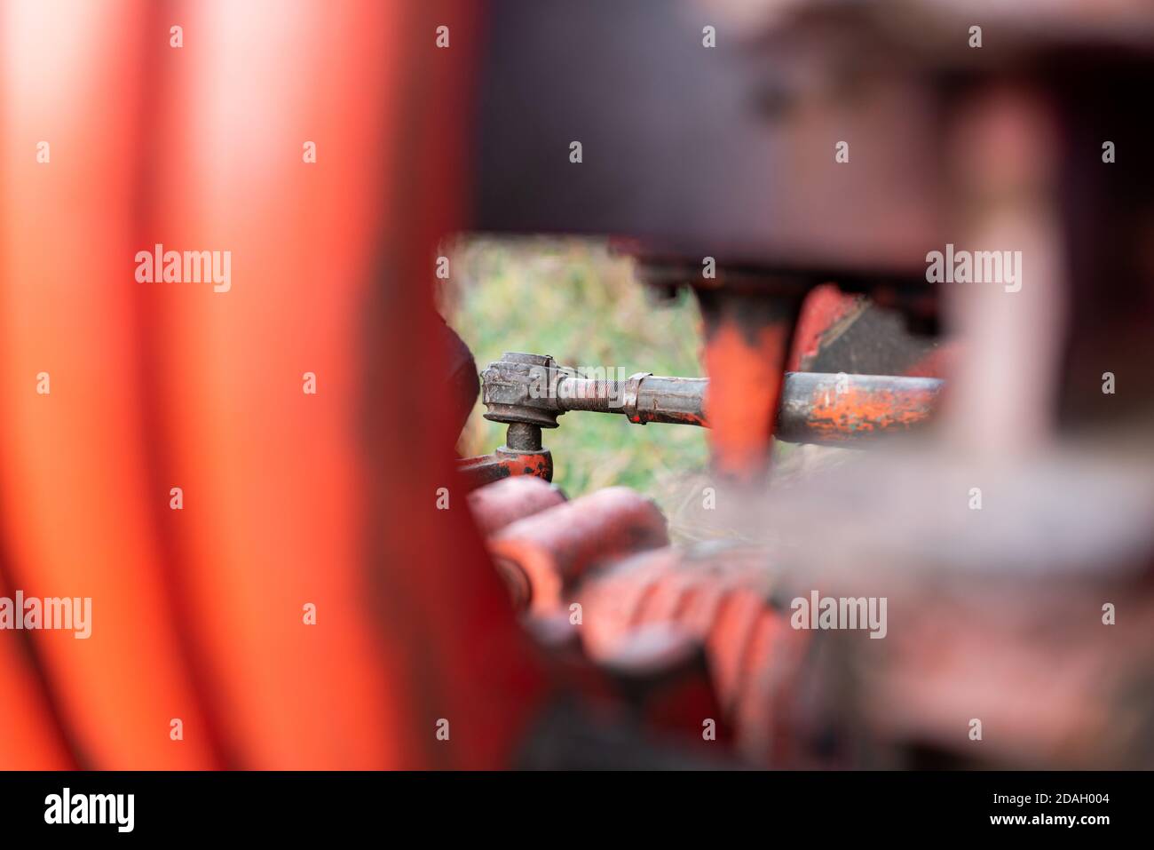 Close up sharp selective focus on front wheel turning mechanism on old ...
