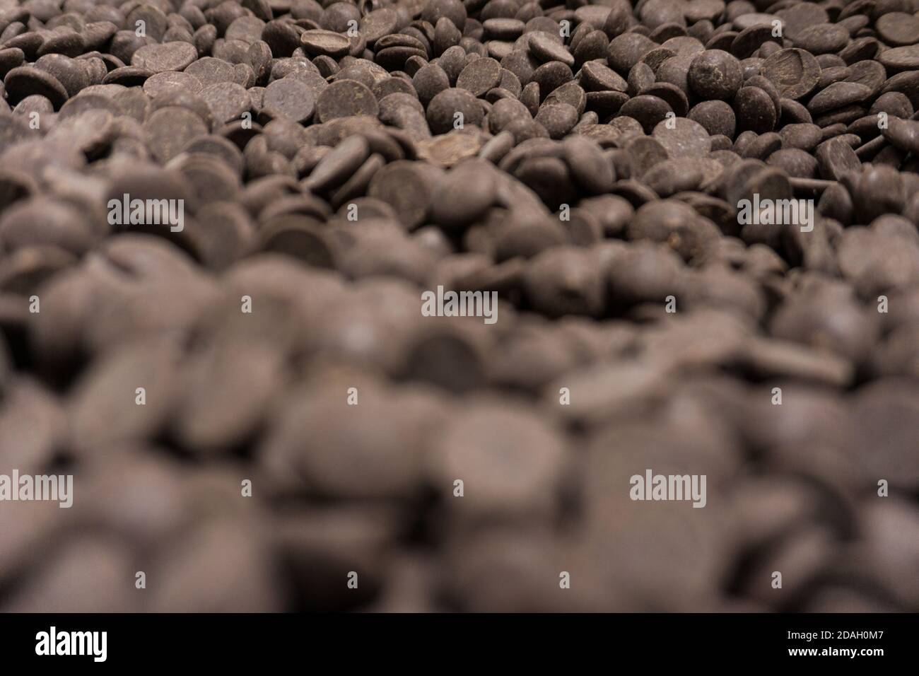 Field of many dark brown chocolat pellets Stock Photo - Alamy