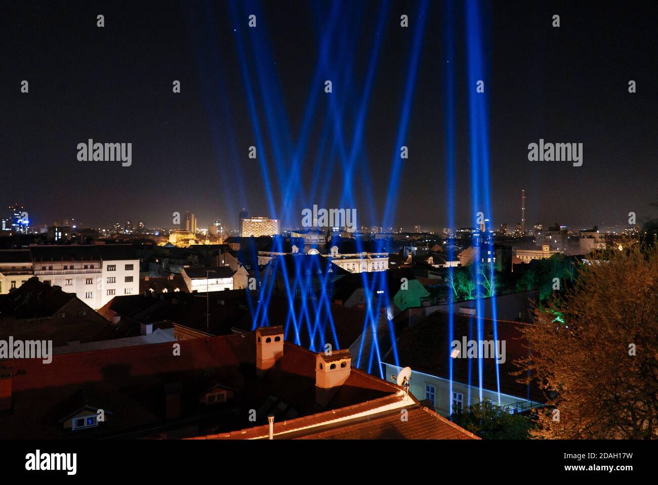 Rays of bright blue light shining from a city Stock Photo - Alamy