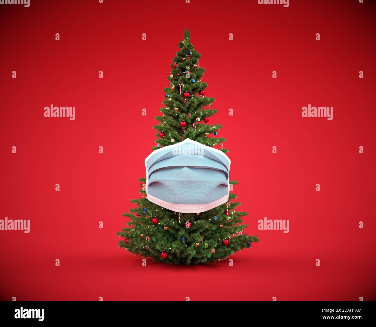 Christmas tree protected with a surgical mask. Red background Stock ...