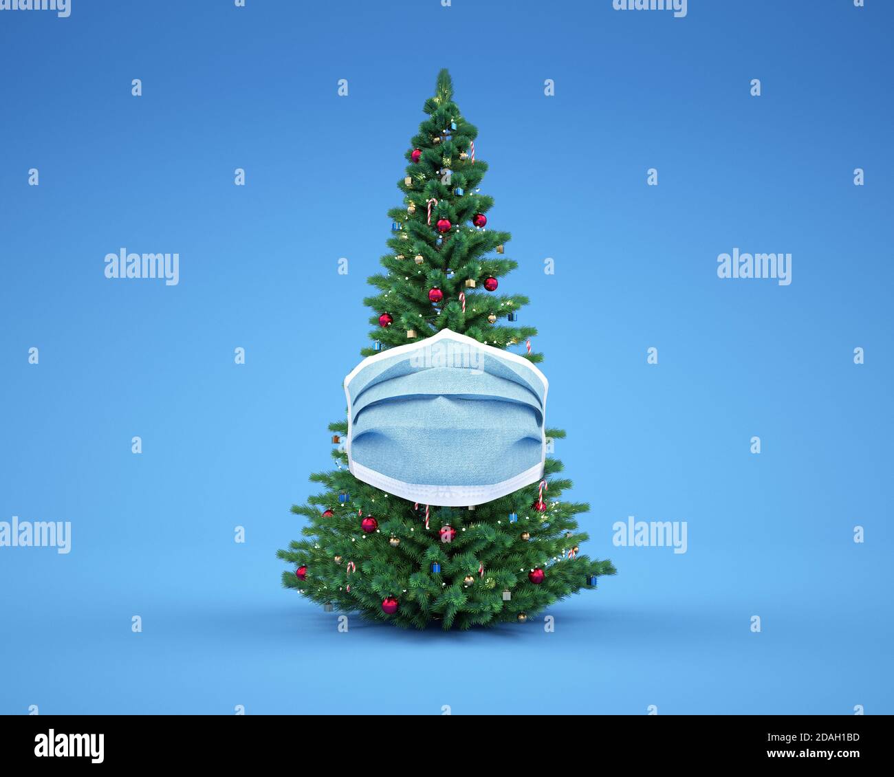 Christmas tree protected with a surgical mask. Blue background Stock ...
