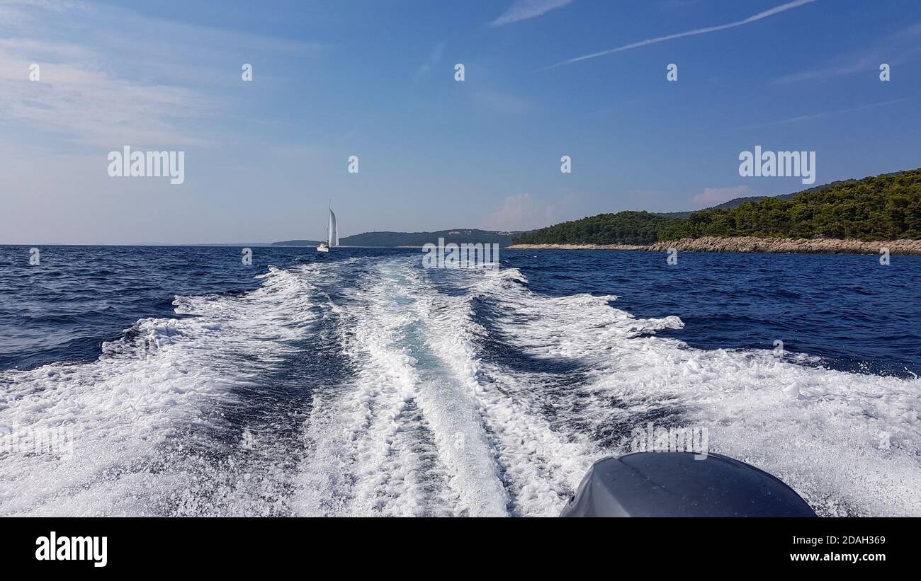 White water trail in the sea left by a ship Stock Photo - Alamy