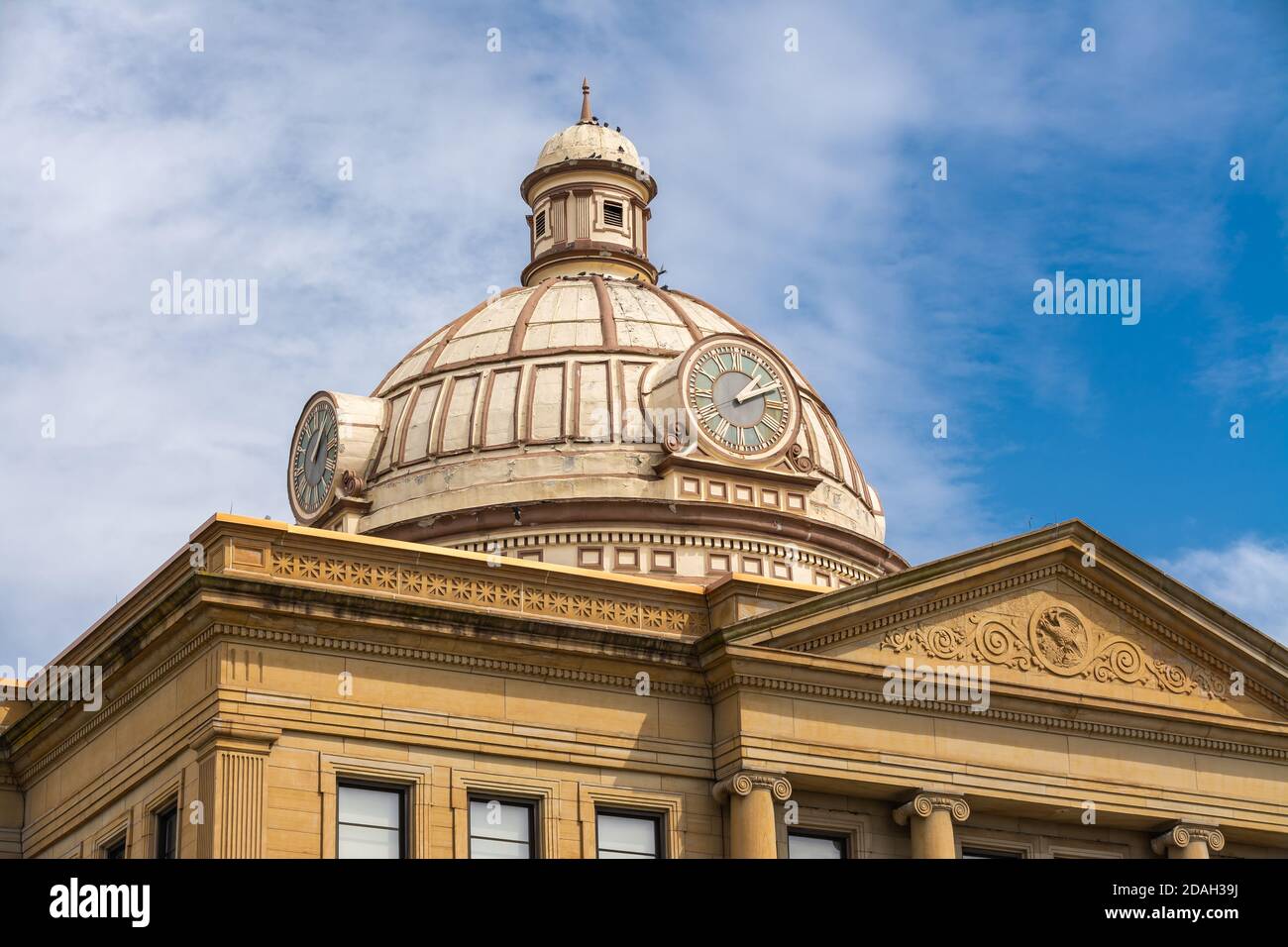 The Logan County Courthouse with blue skies and clouds in the ...