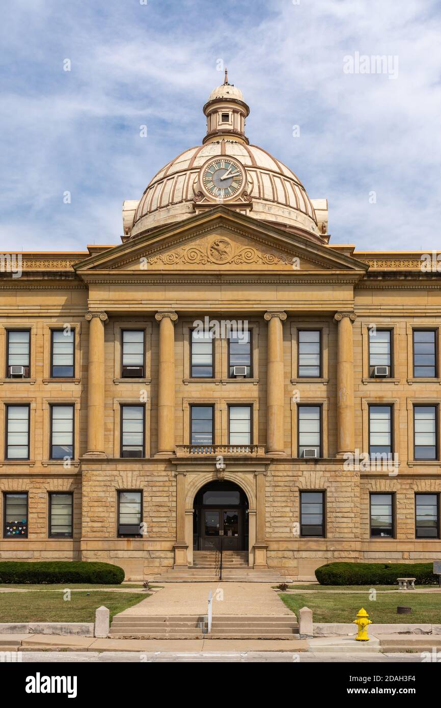 The Logan County Courthouse with blue skies and clouds in the ...