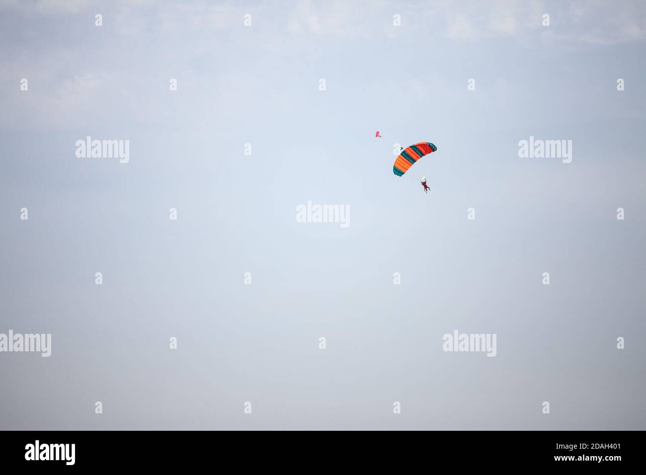 orange and Green parachute, made for two persons, a beginner and an ...