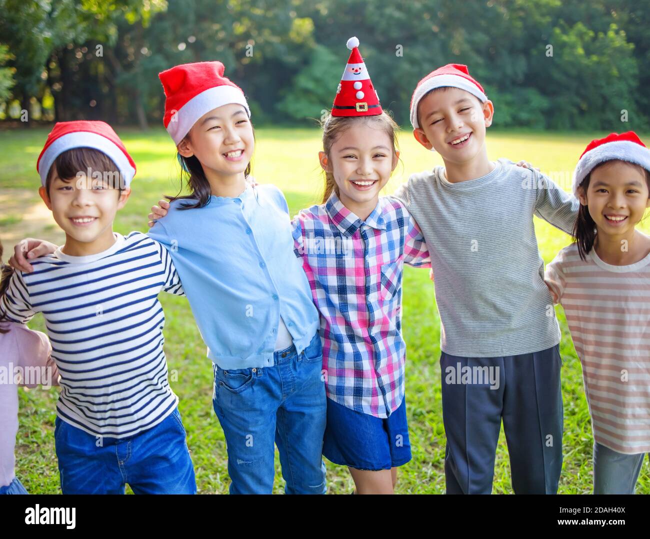 Group of happy kids having fun in christmas party Stock Photo - Alamy