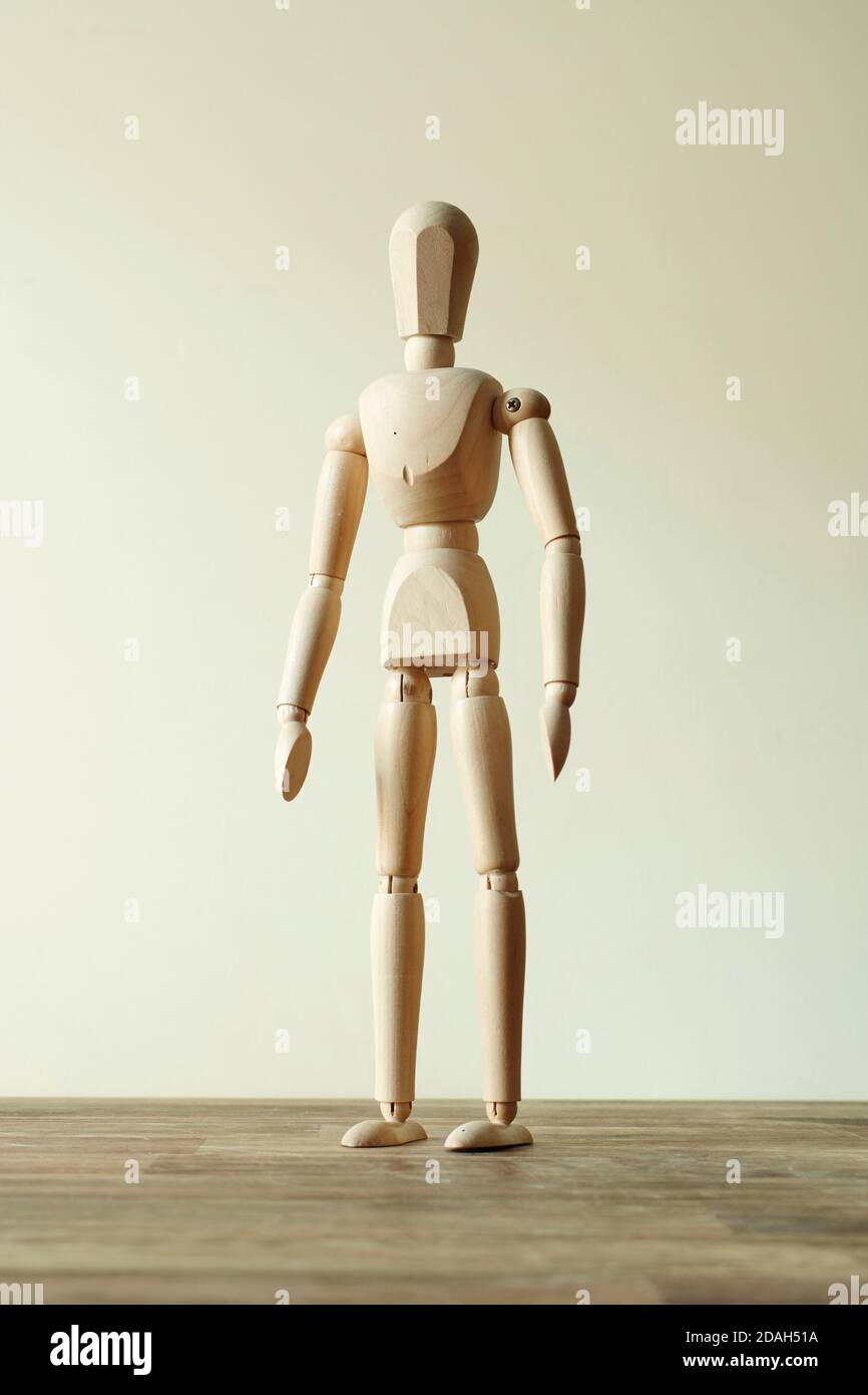 A studio photo of a wooden toy mannequin Stock Photo - Alamy