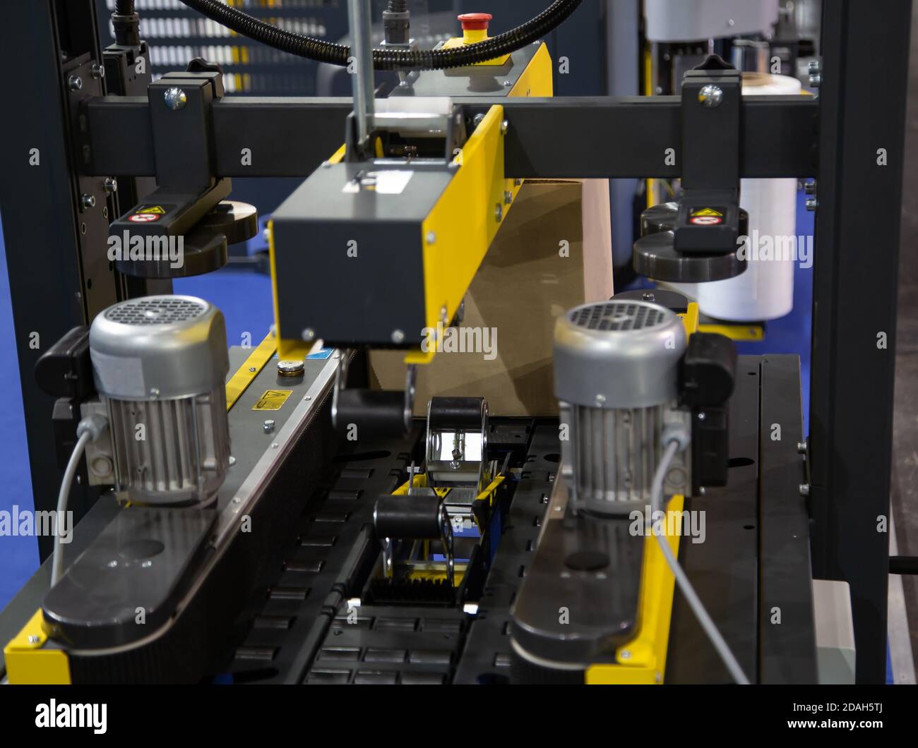 Process of carton forming machine in production line. Warehouse ...