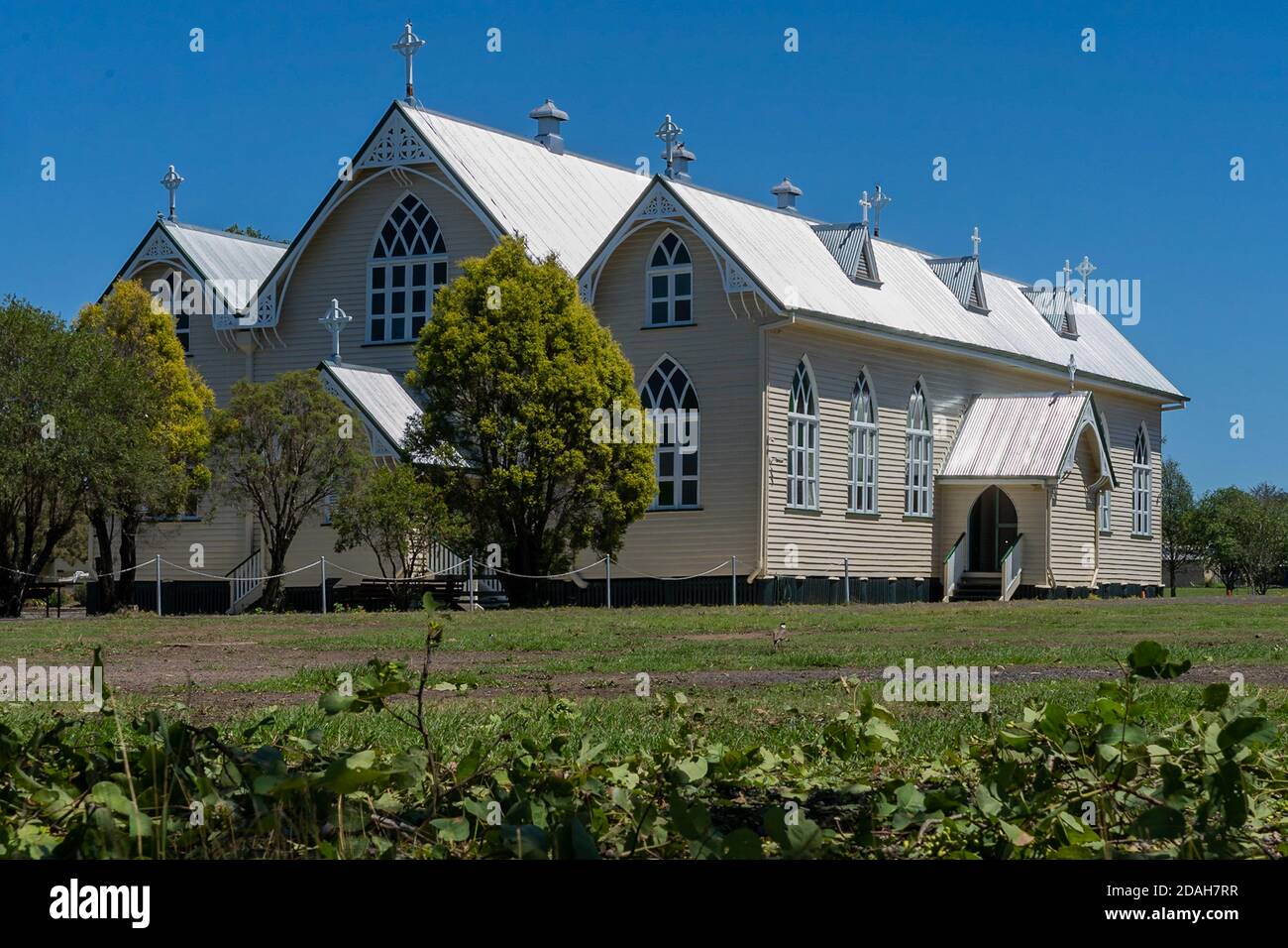 Old church in rural queensland with grass and bush in front Stock Photo ...