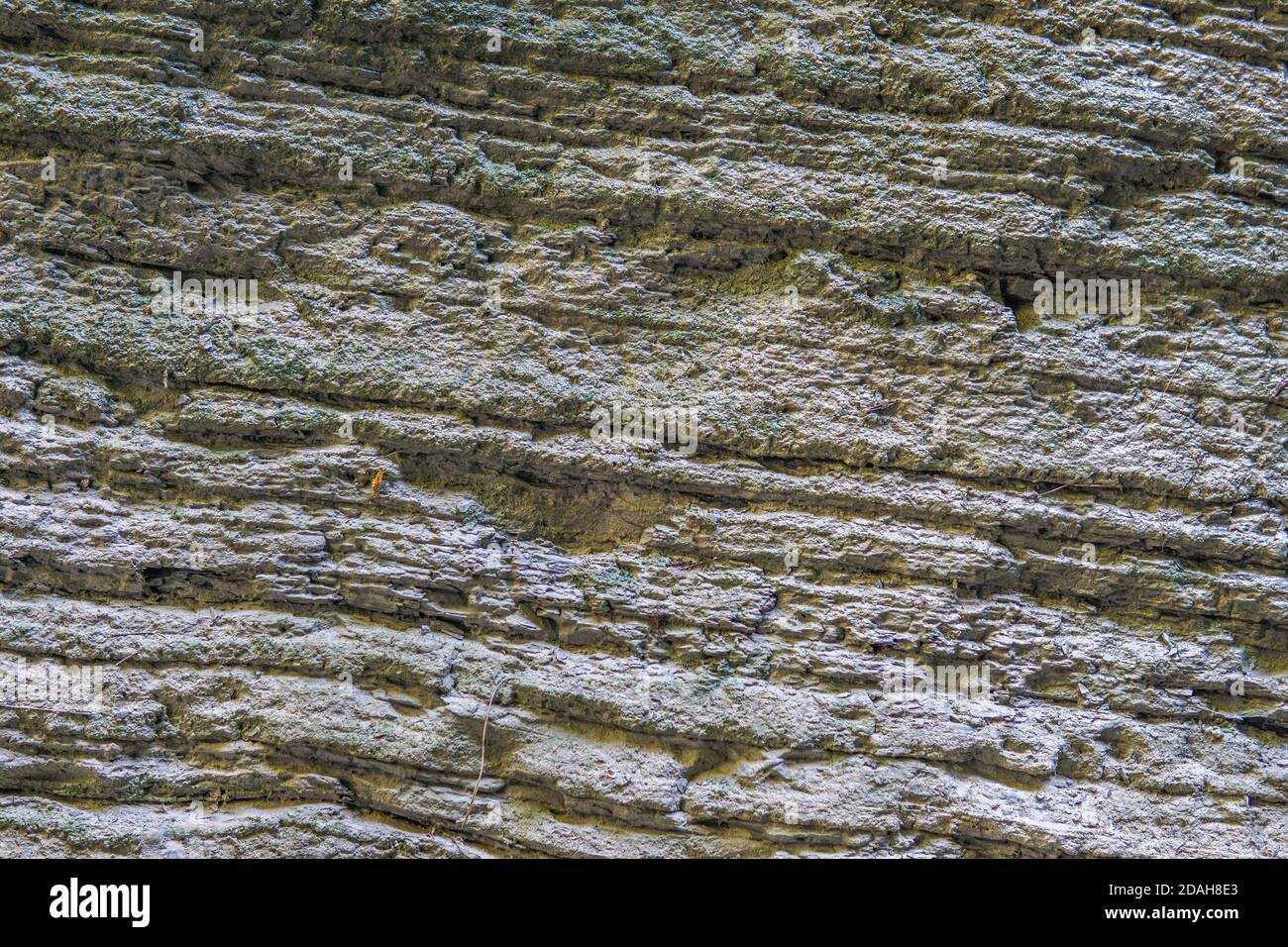background layers in sedimentary rock on cliff face. Cliff of rocky ...