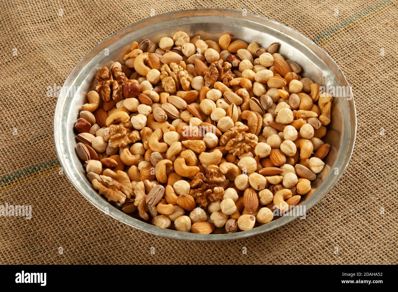 mixed nuts in copper plate Stock Photo - Alamy