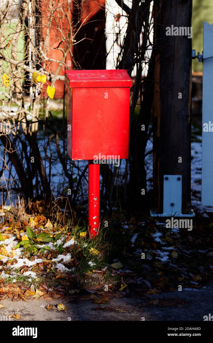 a red metal mailbox in sunset Stock Photo - Alamy