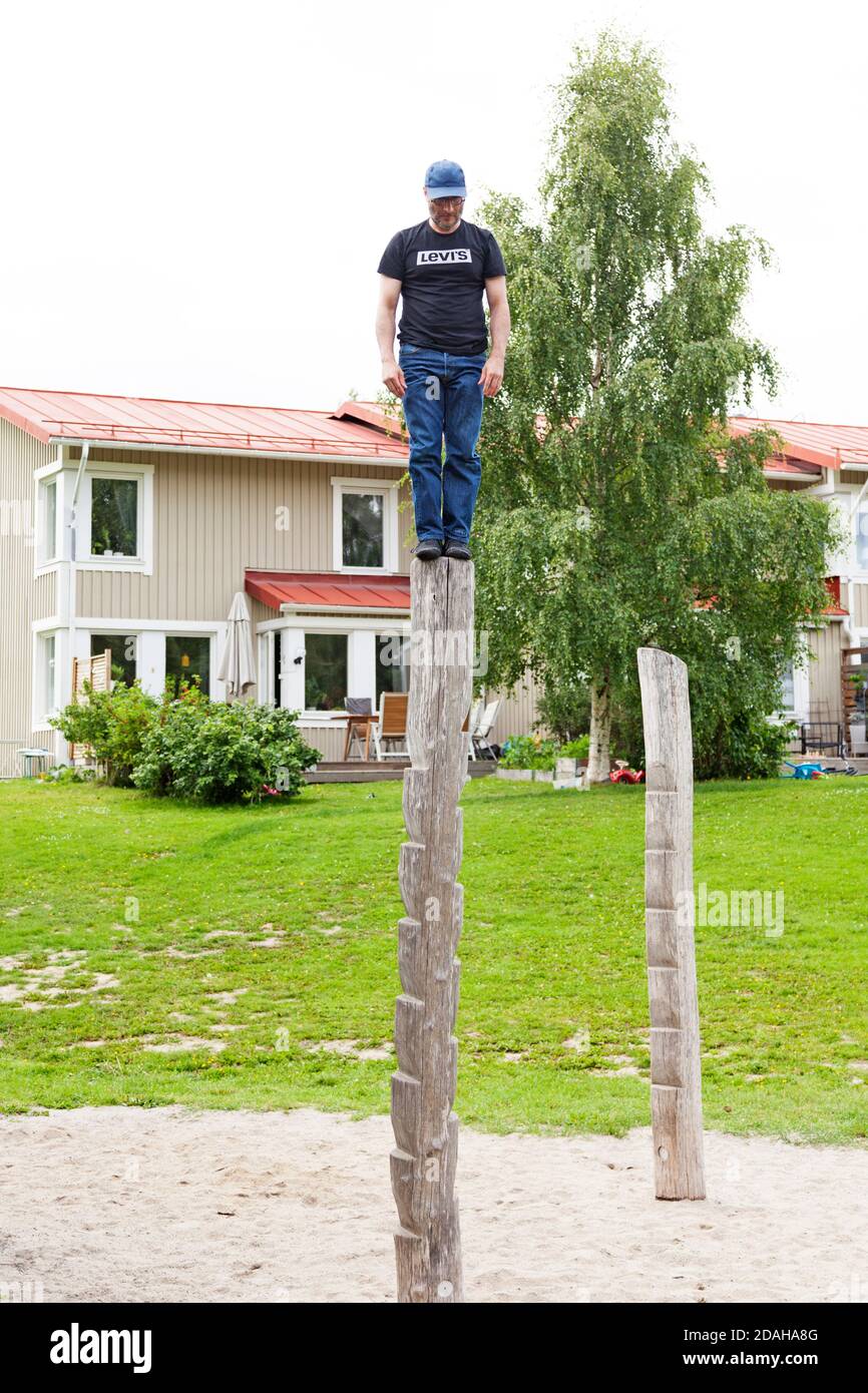 Umea, Norrland Sweden - August 4, 2020: a brave man has climbed a high ...