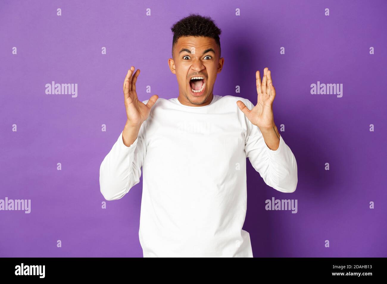 Image of frustrated african-american man, shouting and looking angry ...
