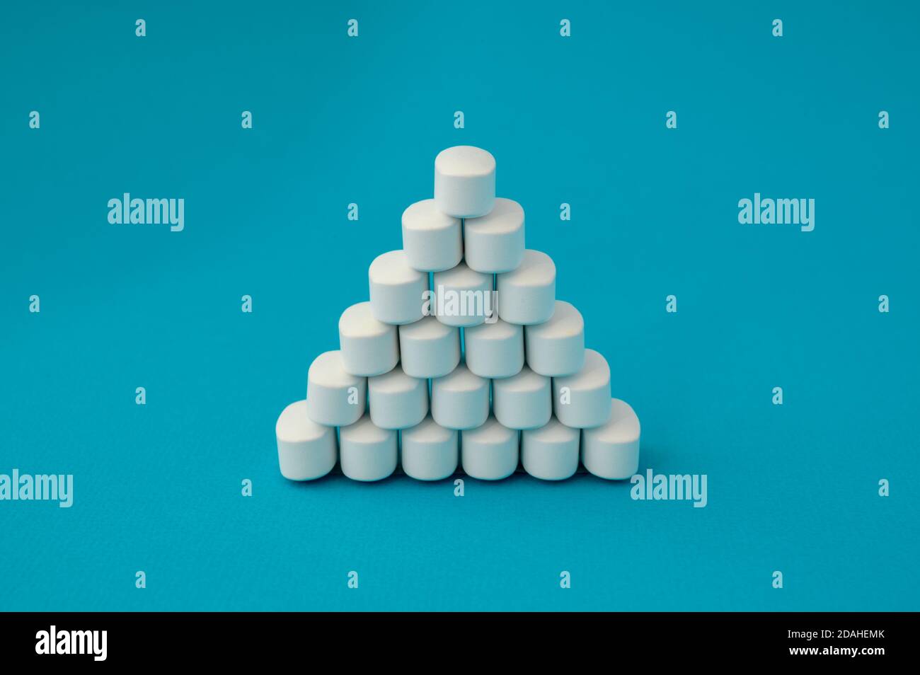 pharmacology medical concept pyramid of white pills tablets drugs on ...