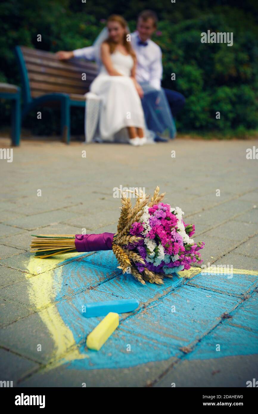 Bride and groom on the bench Stock Photo - Alamy