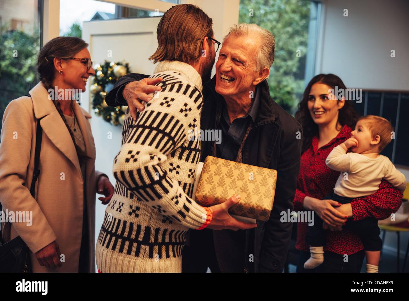 European family coming together for Christmas celebrations. Senior ...