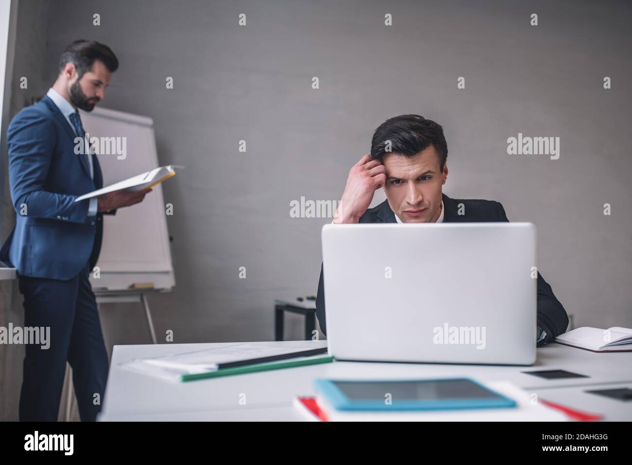 Two men in suits sitting hi-res stock photography and images - Alamy