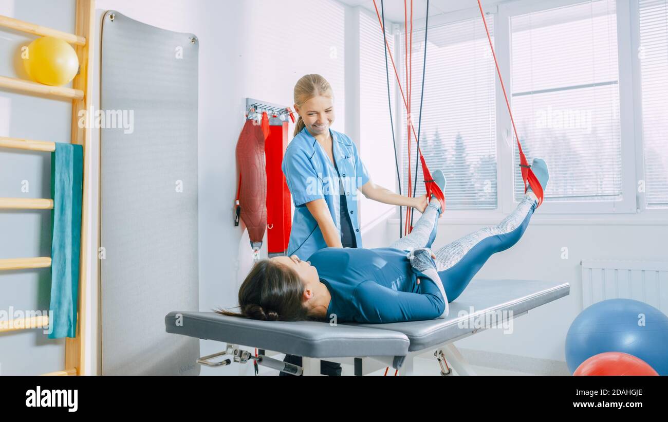 Physiotherapist Assists Female Patient with Trauma, Undergoing ...