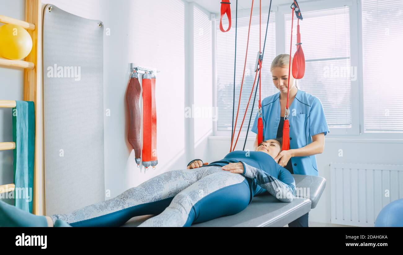Physiotherapist Assists Female Patient with Trauma, Undergoing ...