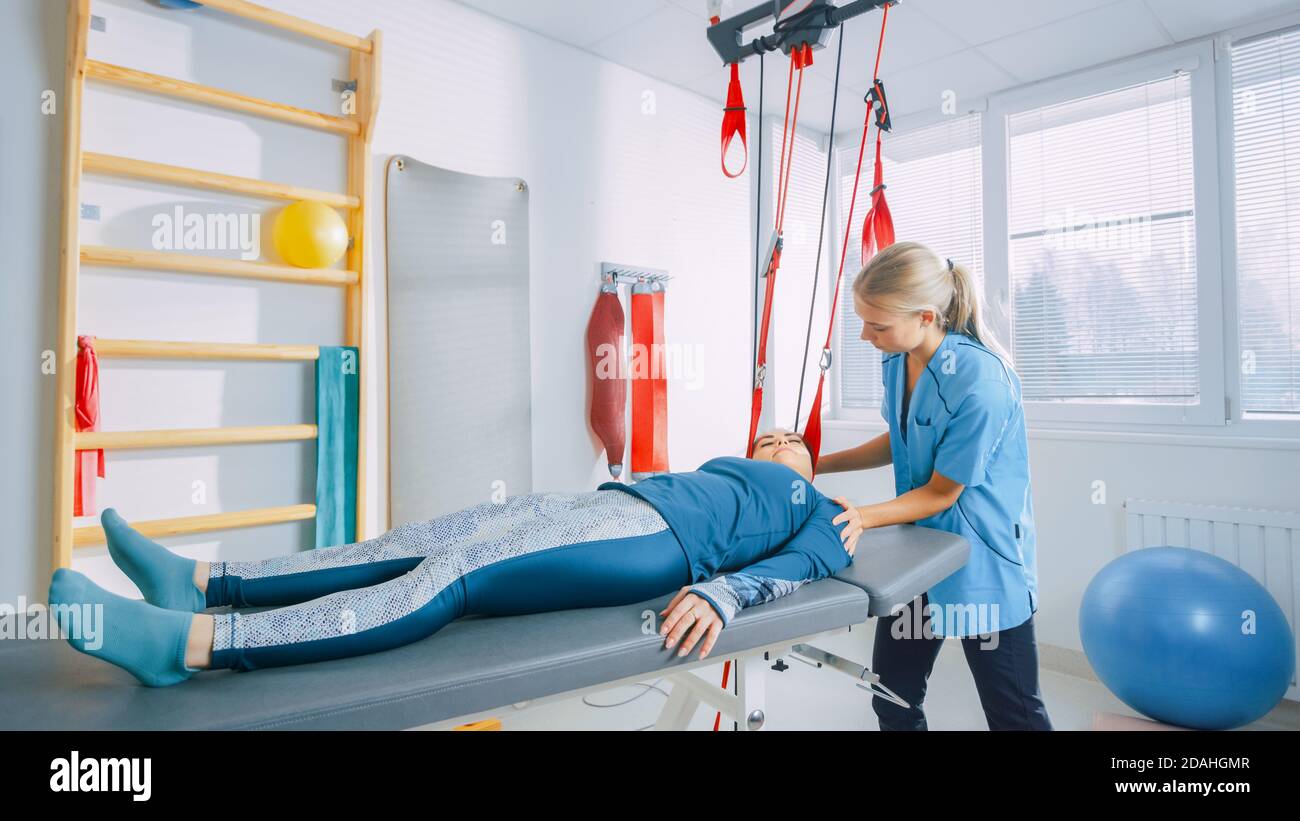 Physiotherapist Assists Female Patient with Trauma, Undergoing ...