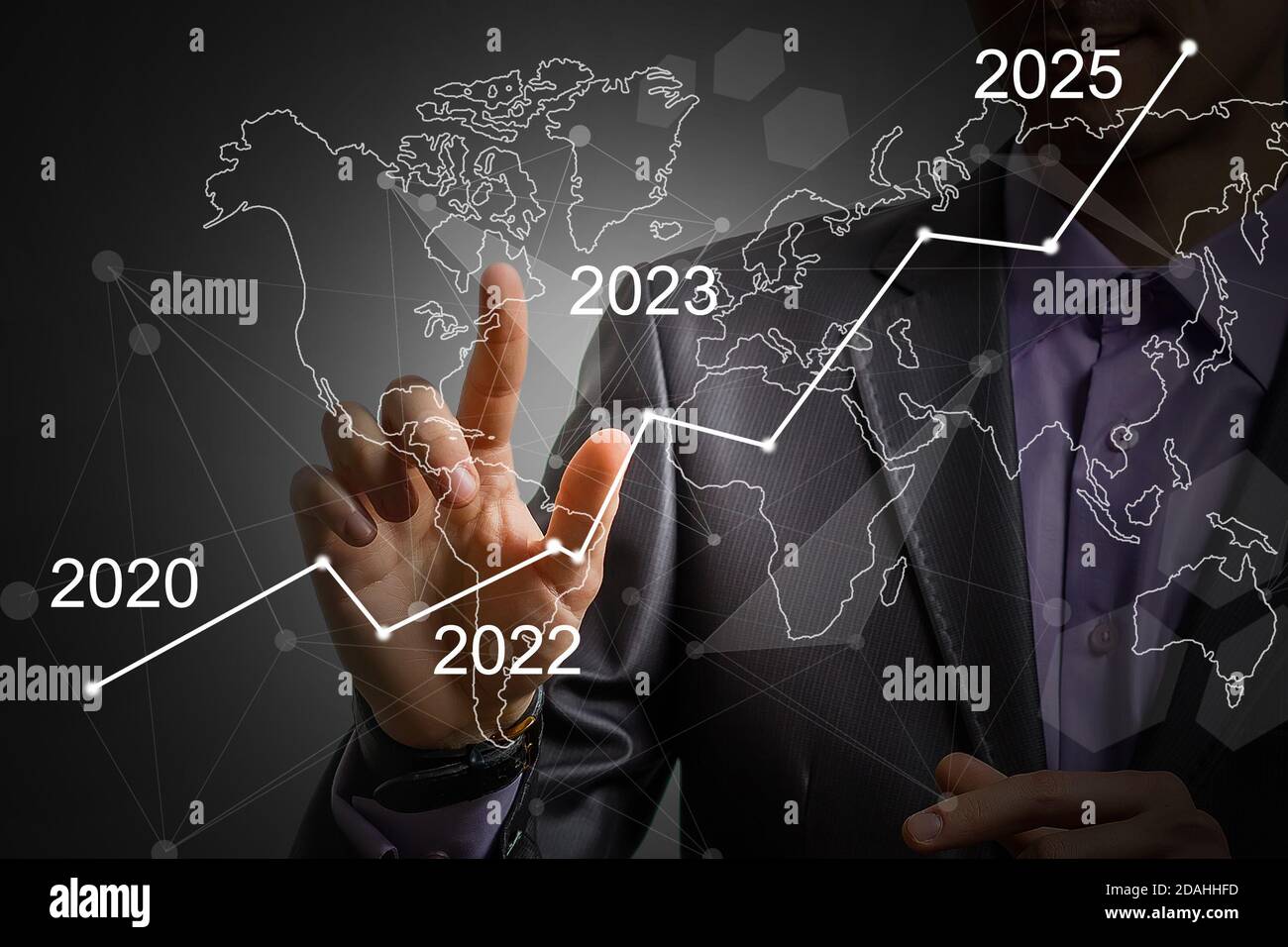 Man's hand pointing graph of success in 2023 year. Growing business ...