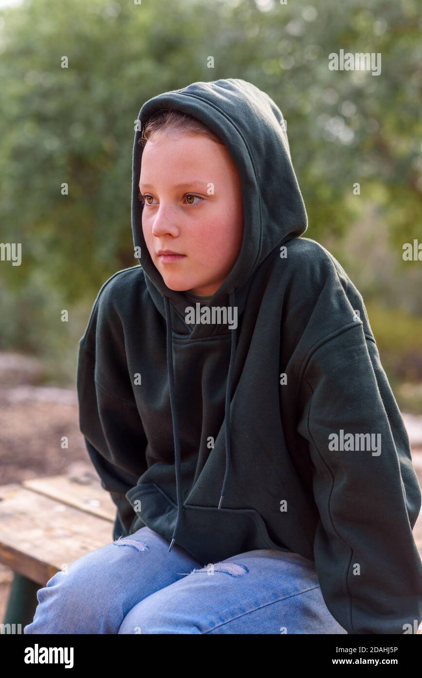 Tween Beautiful Girl In A Hoodie. Portrait Of A Pensive Dreamer Teenage ...