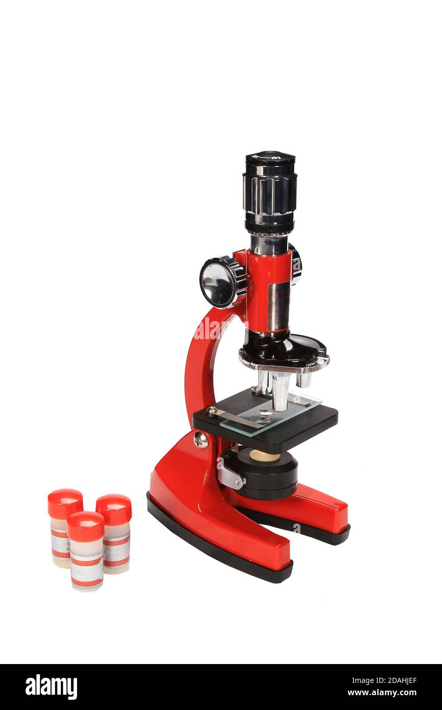 Vertical shot of red microscope isolated on white background Stock ...