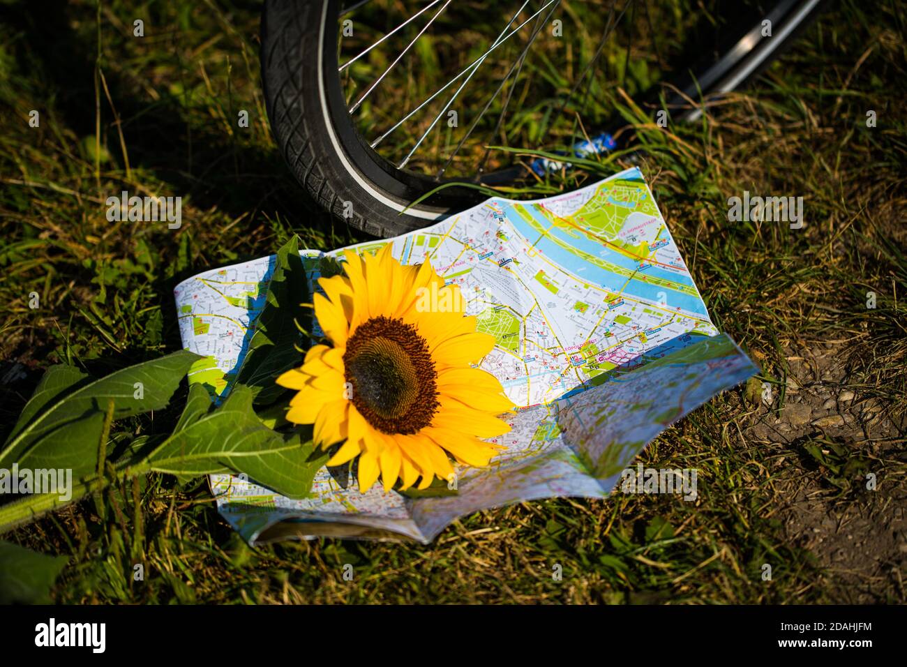 Bicycle tour, map is in front of front wheel, bike ride Stock Photo - Alamy