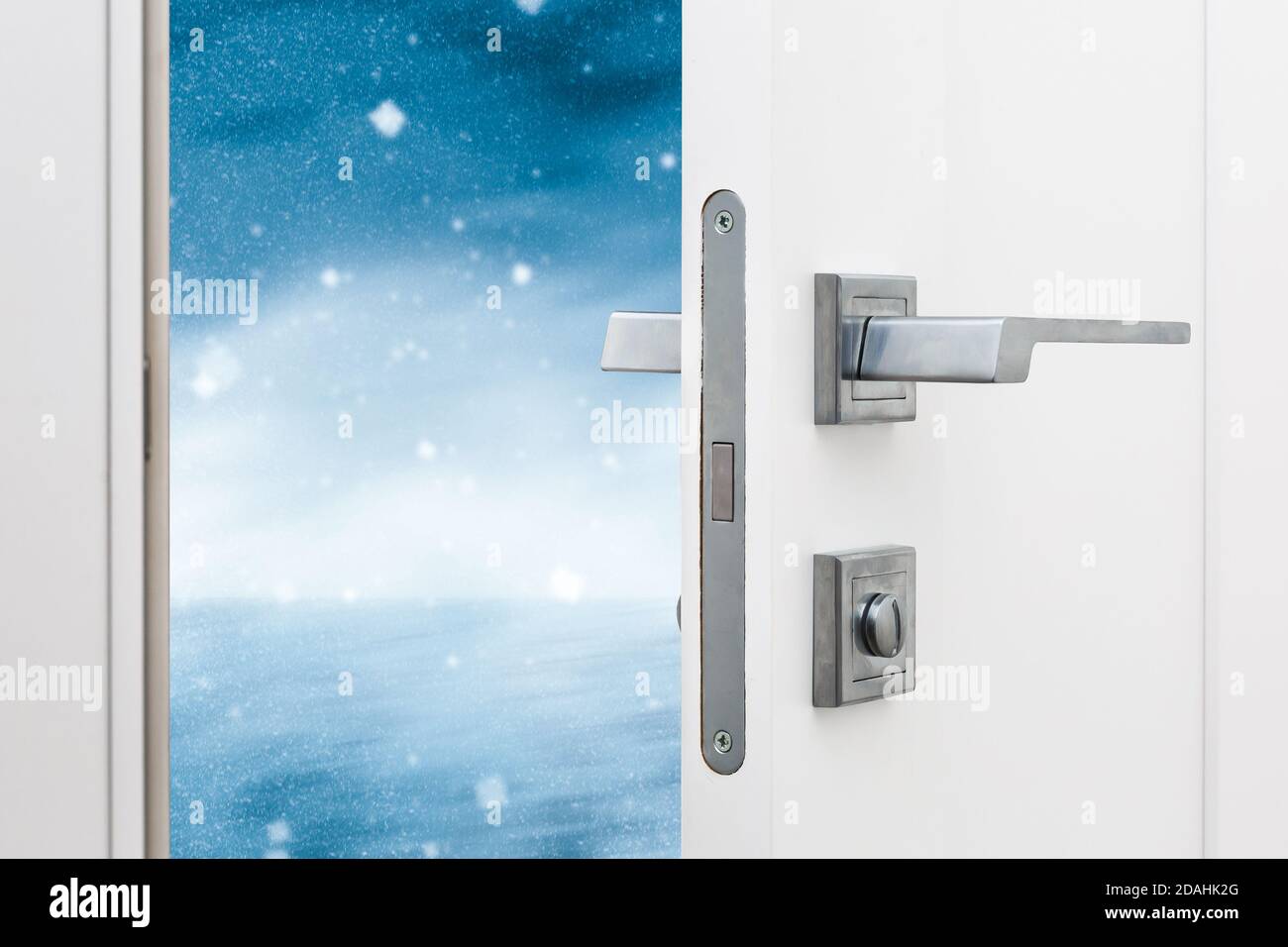 doors opening outside to a snowy winter scene Stock Photo - Alamy