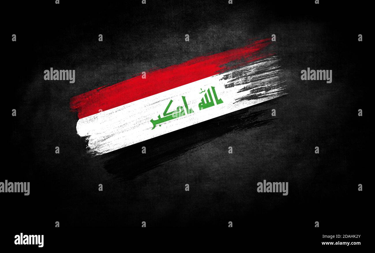 smear of paint in the form of the flag of Iraq close-up on a black ...