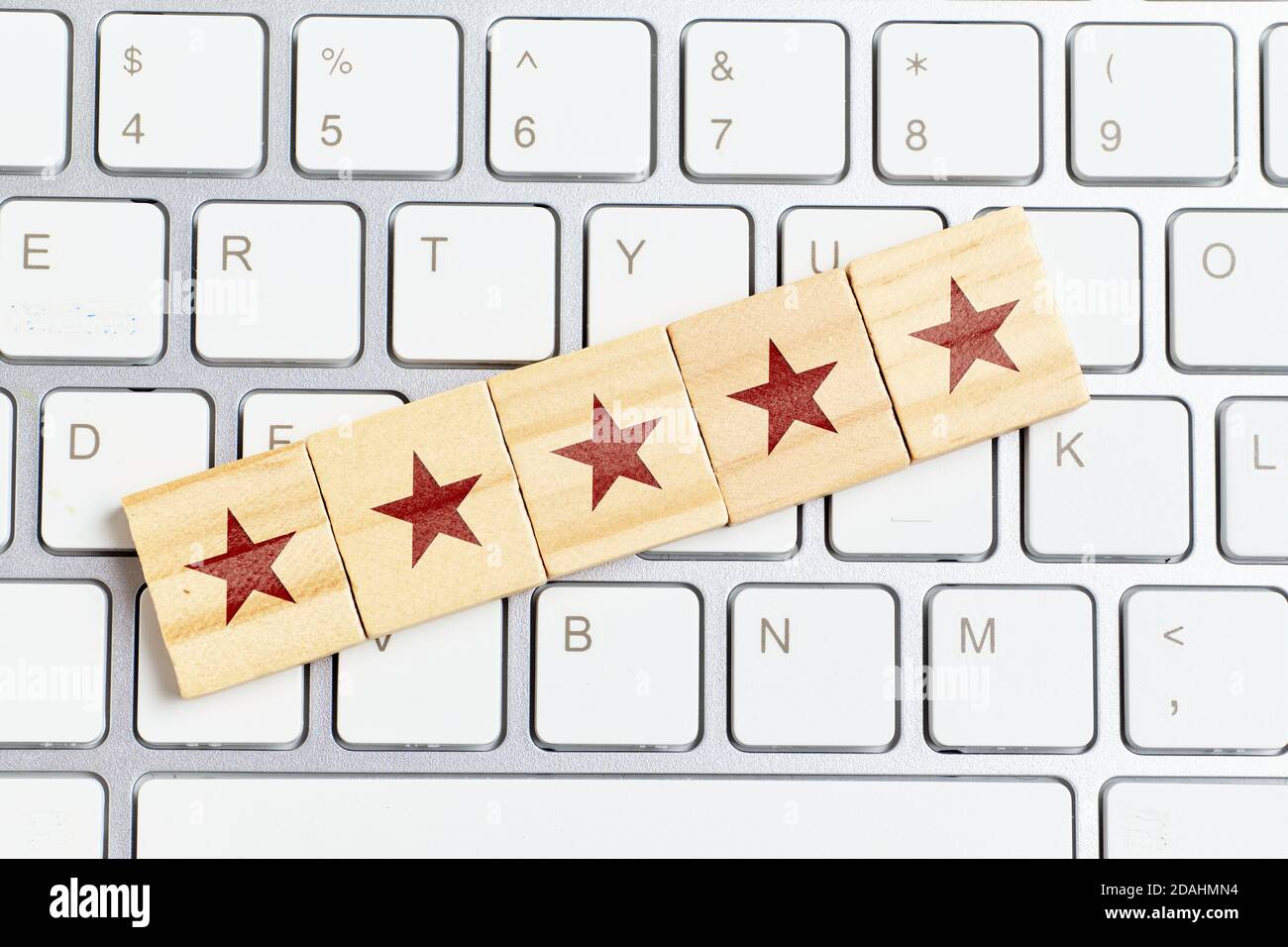 Concept of the highest rating of five stars on the keyboard Stock Photo ...