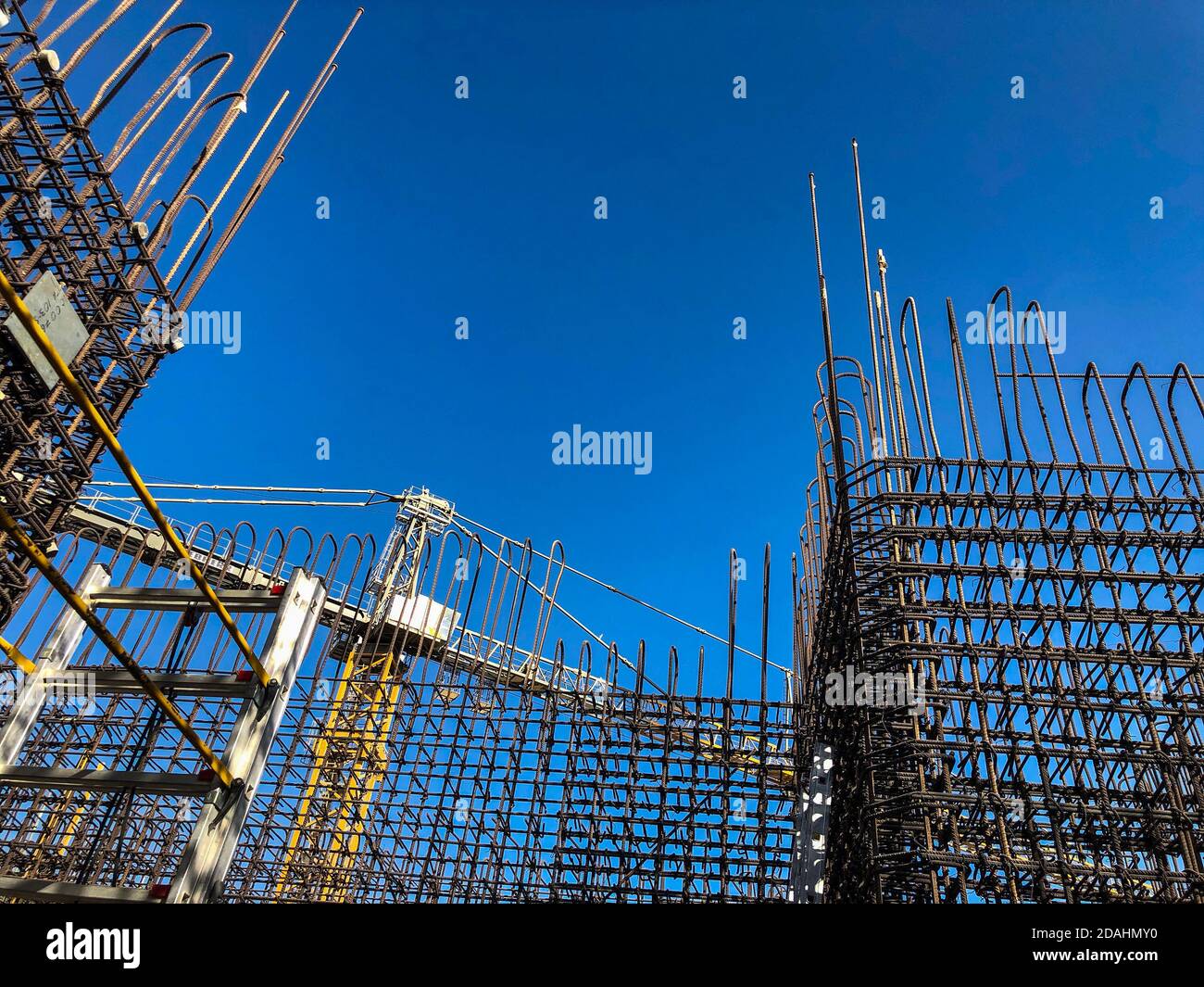 Tower crane and metal reinforcement framework of concrete wall Stock ...