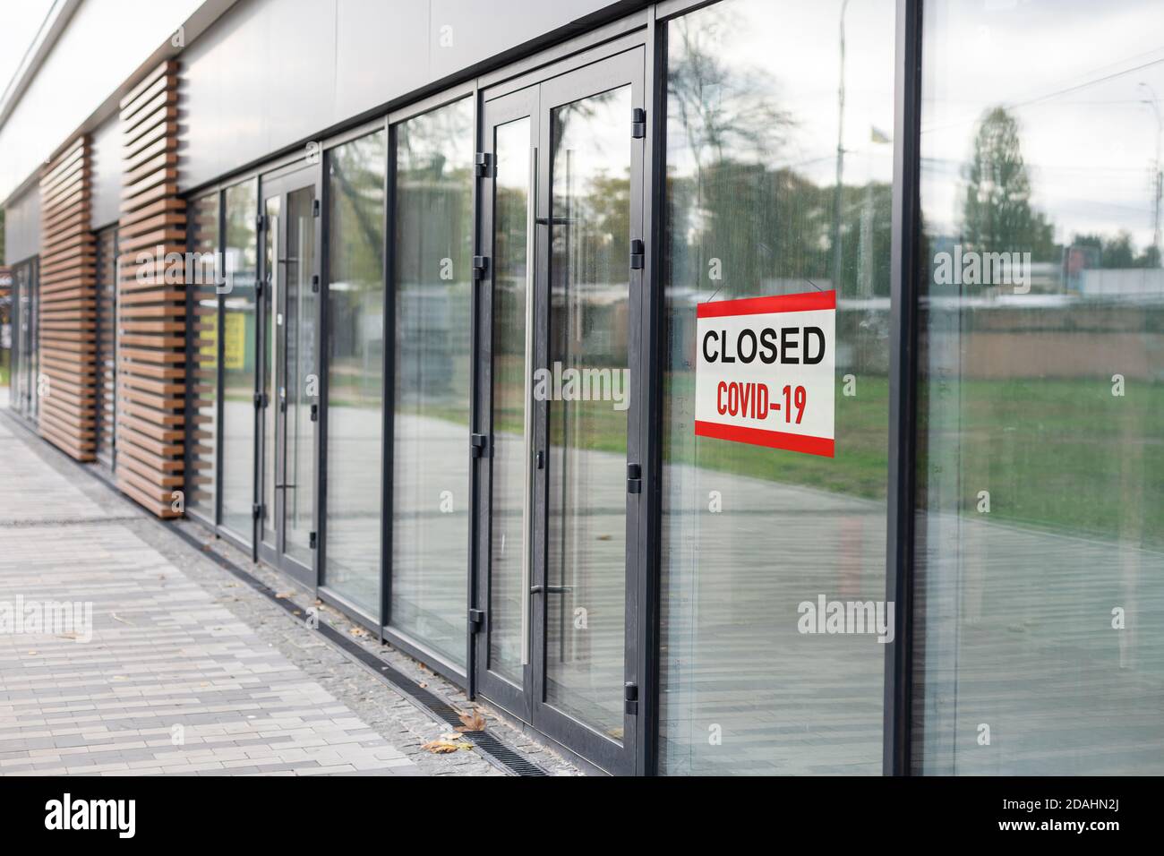 Sorry we're closed sign. grunge image hanging on a dirty glass door ...