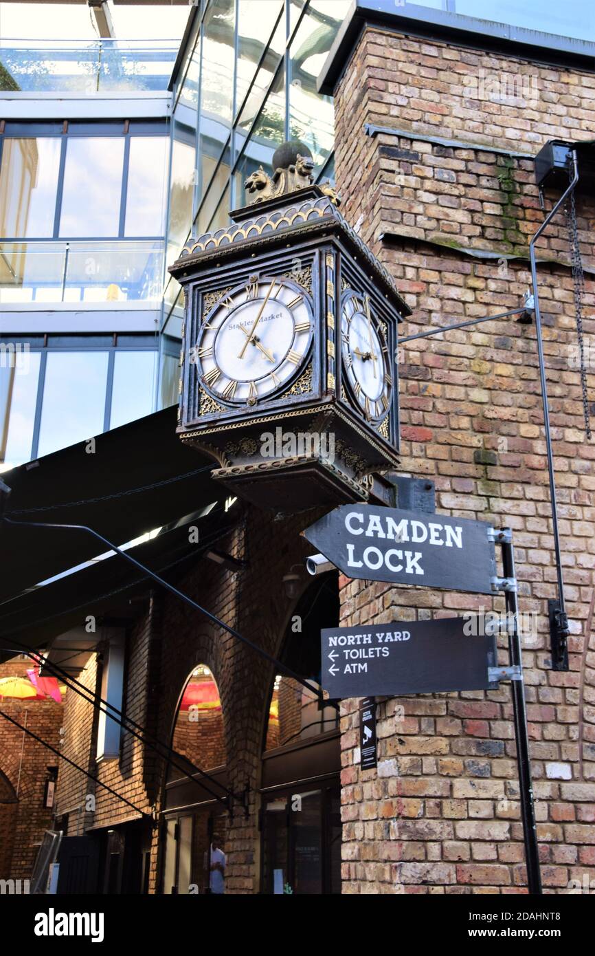 Stables Market clock and Camden Lock sign detail, Camden Market, London ...