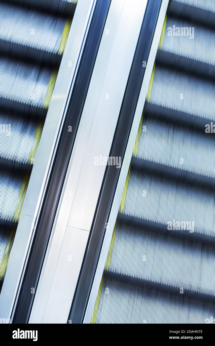 Moving steps of the escalator and railing close-up Stock Photo - Alamy