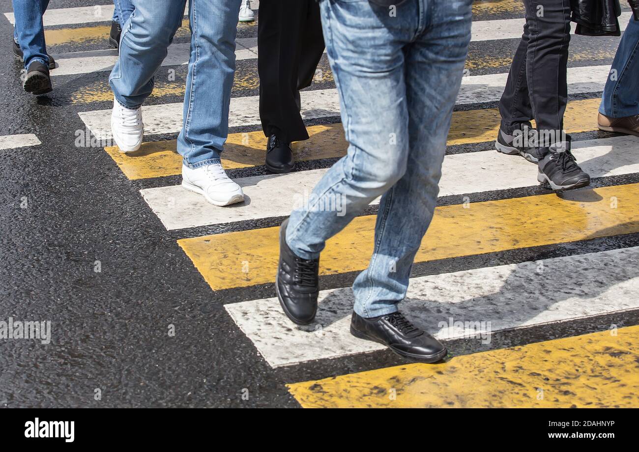 people walking on the road at a pedestrian crossing Stock Photo - Alamy
