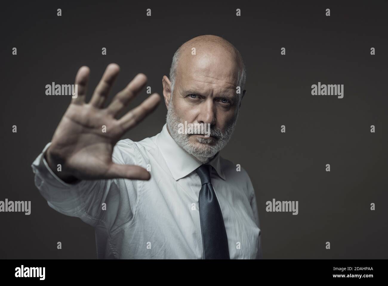 Stopping middle aged businessman rejecting hi-res stock photography and ...