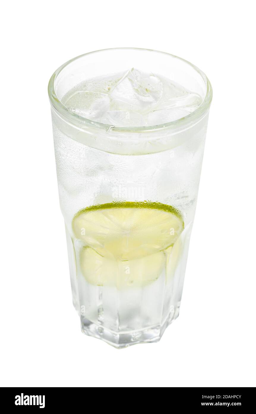 gin and tonic cocktail in highball glass with two slices of lime and ice cubes isolated on white ...