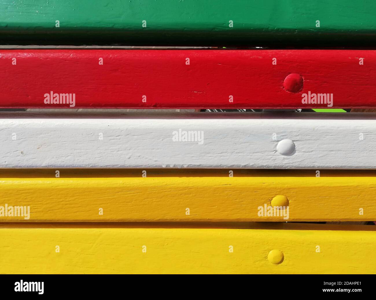 Closeup shot of a colorful painted wooden bench Stock Photo - Alamy