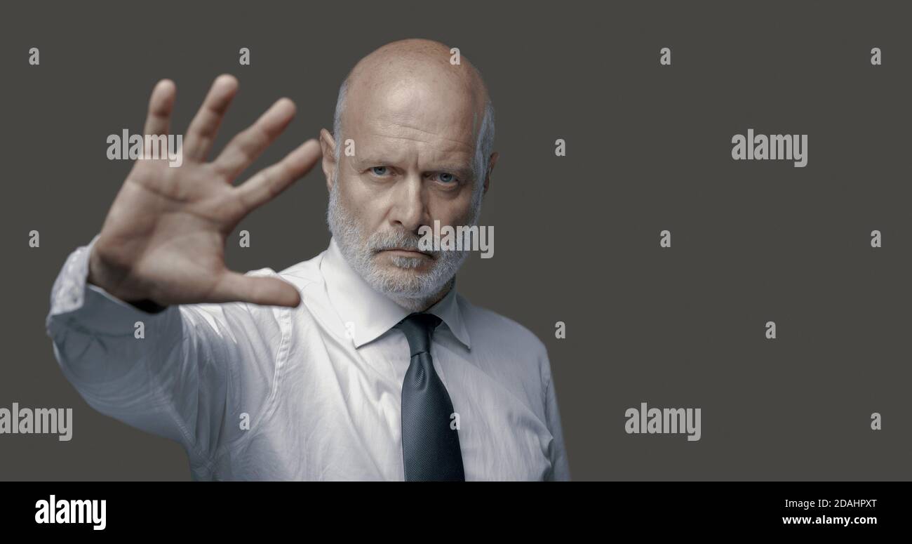 Stopping middle aged businessman rejecting hi-res stock photography and ...
