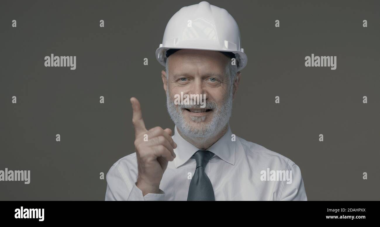 Senior manager wearing safety helmet hi-res stock photography and ...