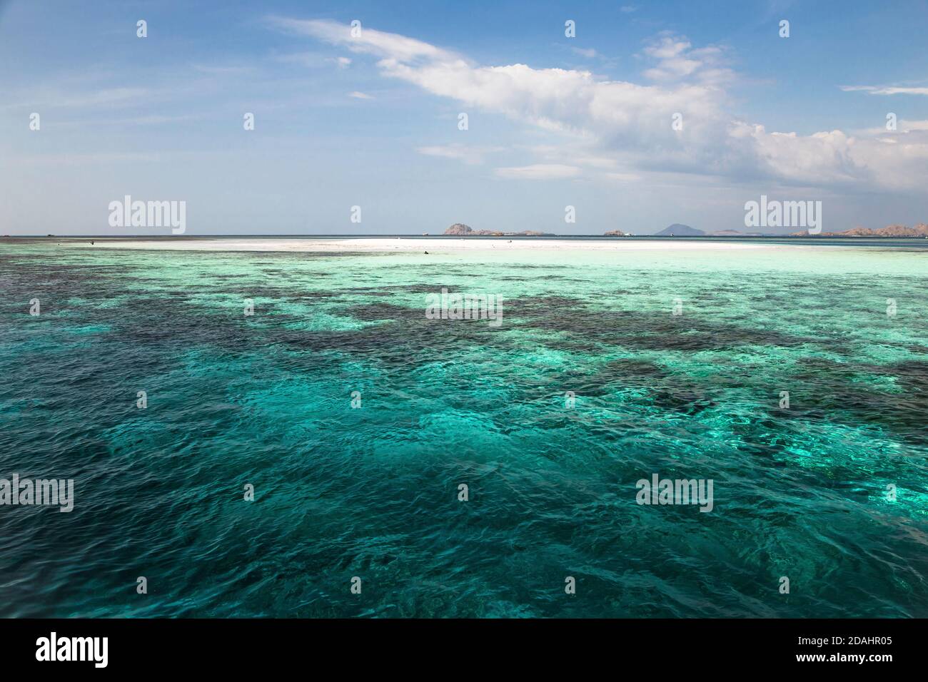 Scenic view of atoll surrounded by turquoise clear ocean water, Komodo ...
