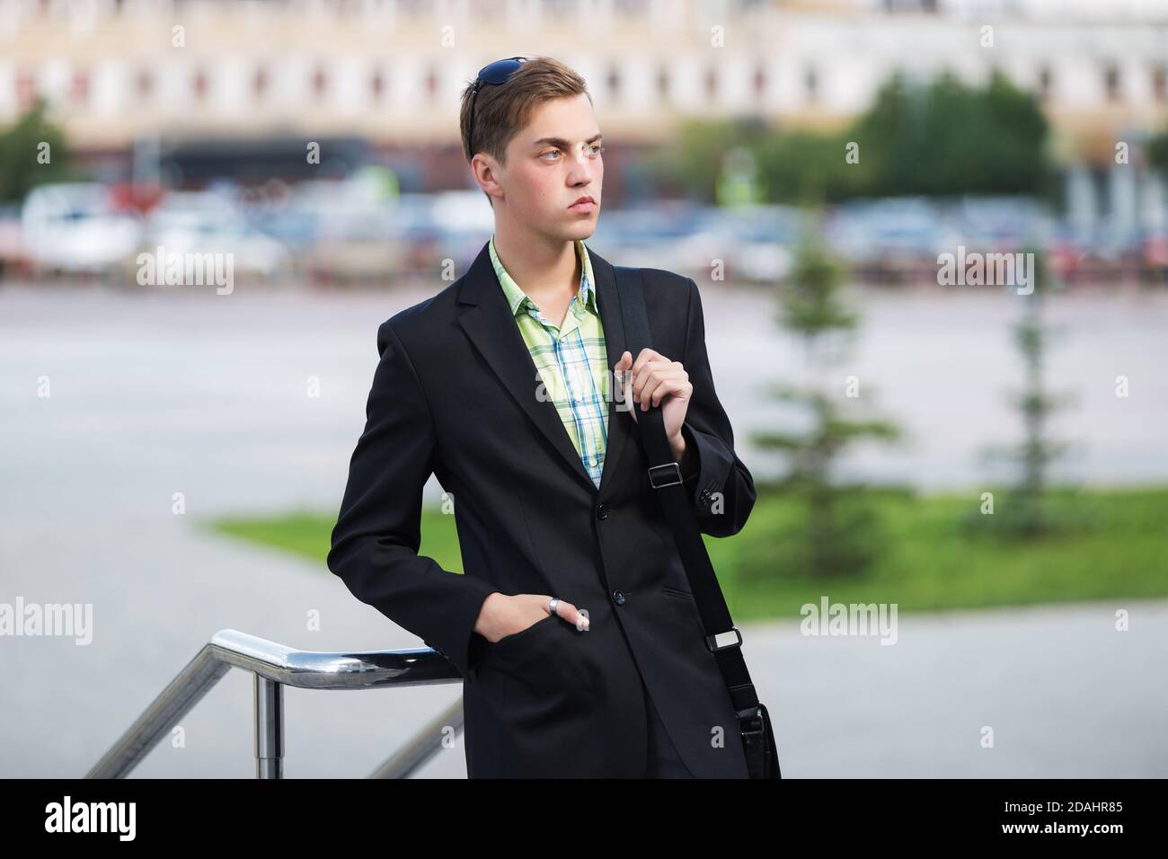 Young handsome business man leaning on railing Stylish fashion male ...